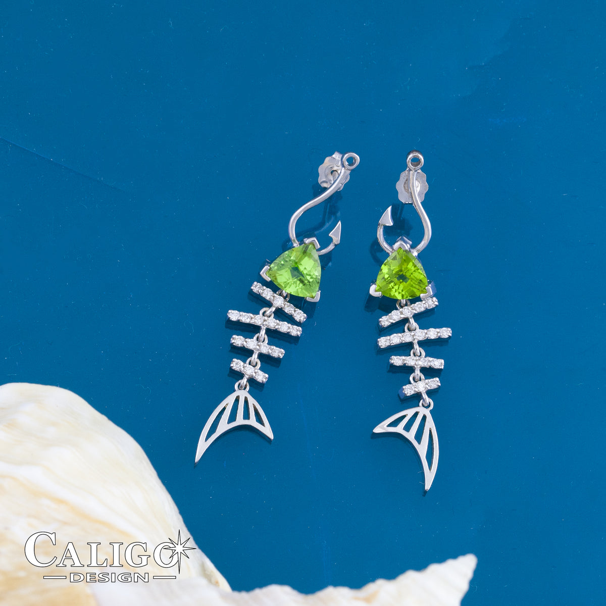 Bone fish earrings - gold and diamond fish earrings with peridot ...